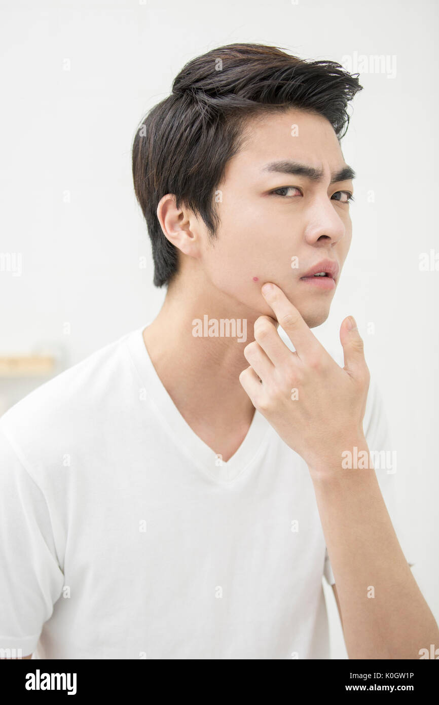 Portrait of stressful grooming with pimple on his face Stock Photo - Alamy