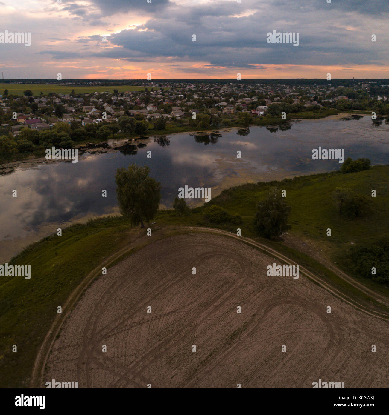 Panorama of countryside with a beautiful lake at sunset Stock Photo - Alamy
