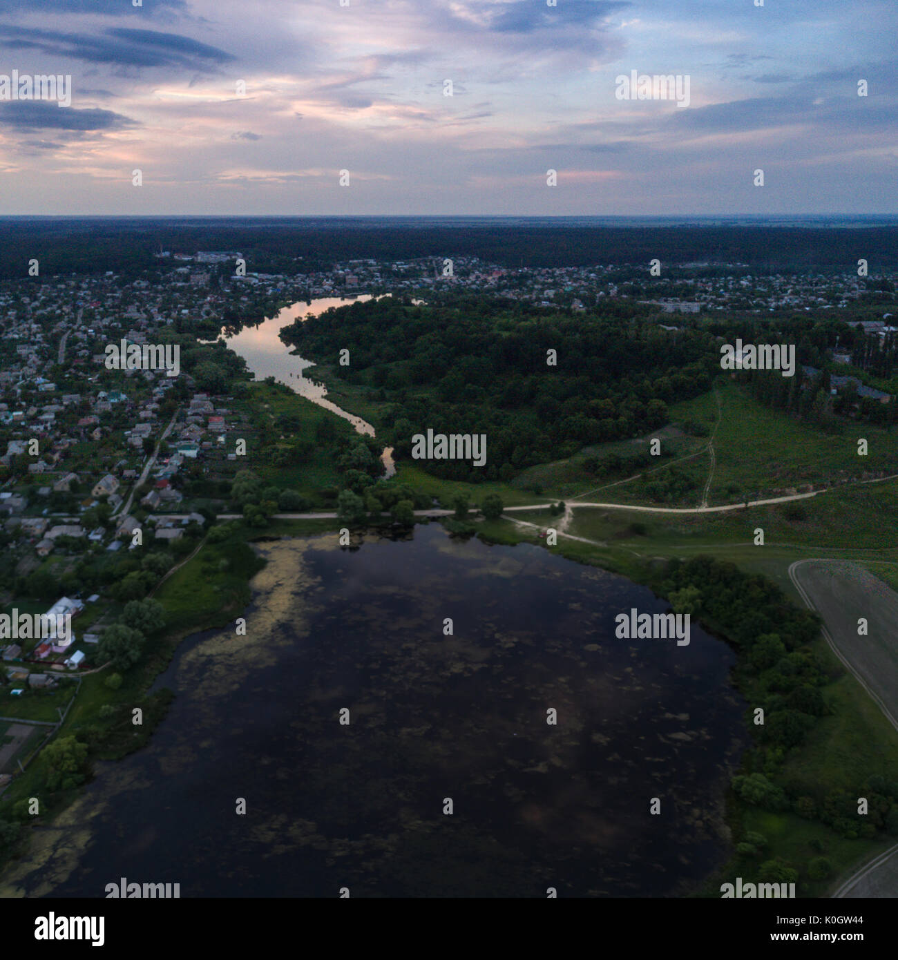 Panorama of countryside with a beautiful lake at sunset Stock Photo - Alamy