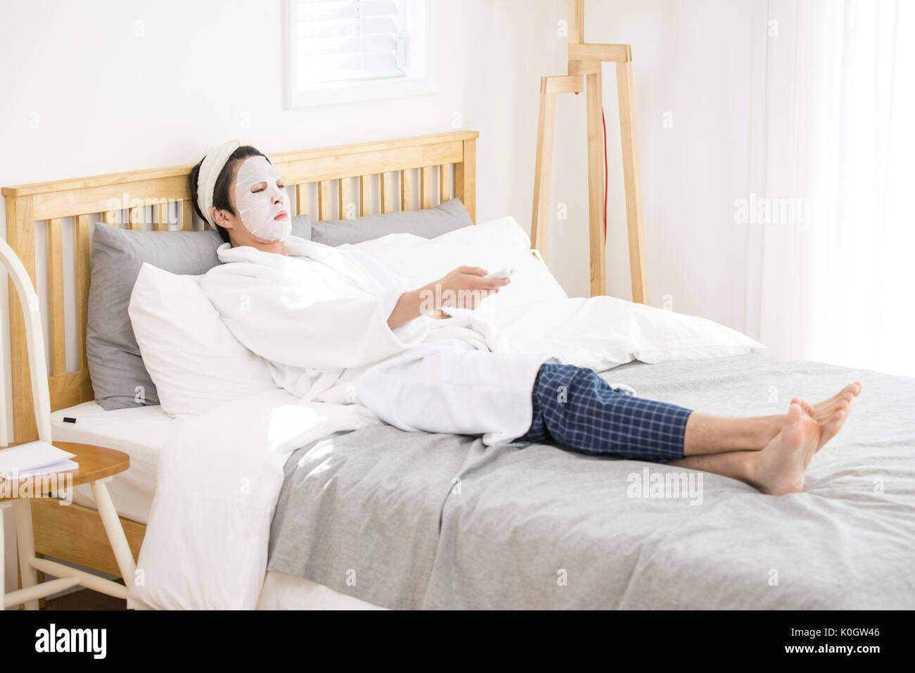 Grooming with beauty mask pack resting on bed Stock Photo - Alamy