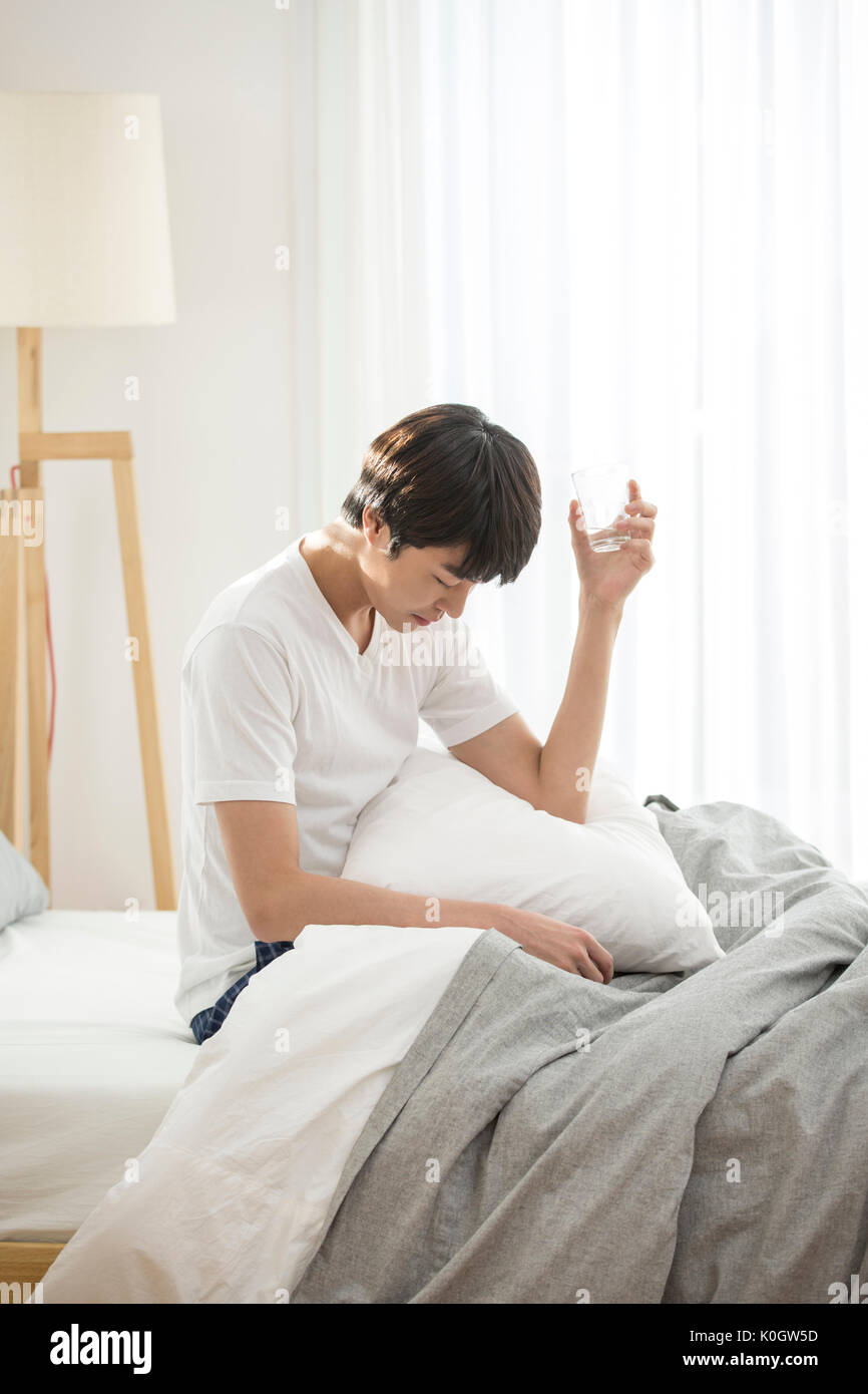 Man and bed one man only getting up hi-res stock photography and images ...