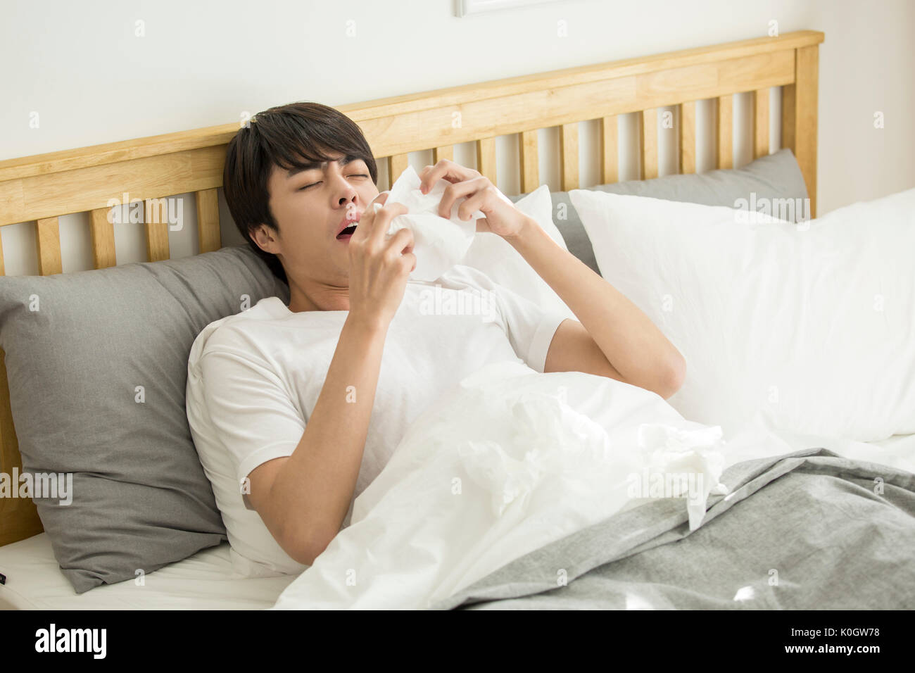 Sick man resting in bed hi-res stock photography and images - Alamy
