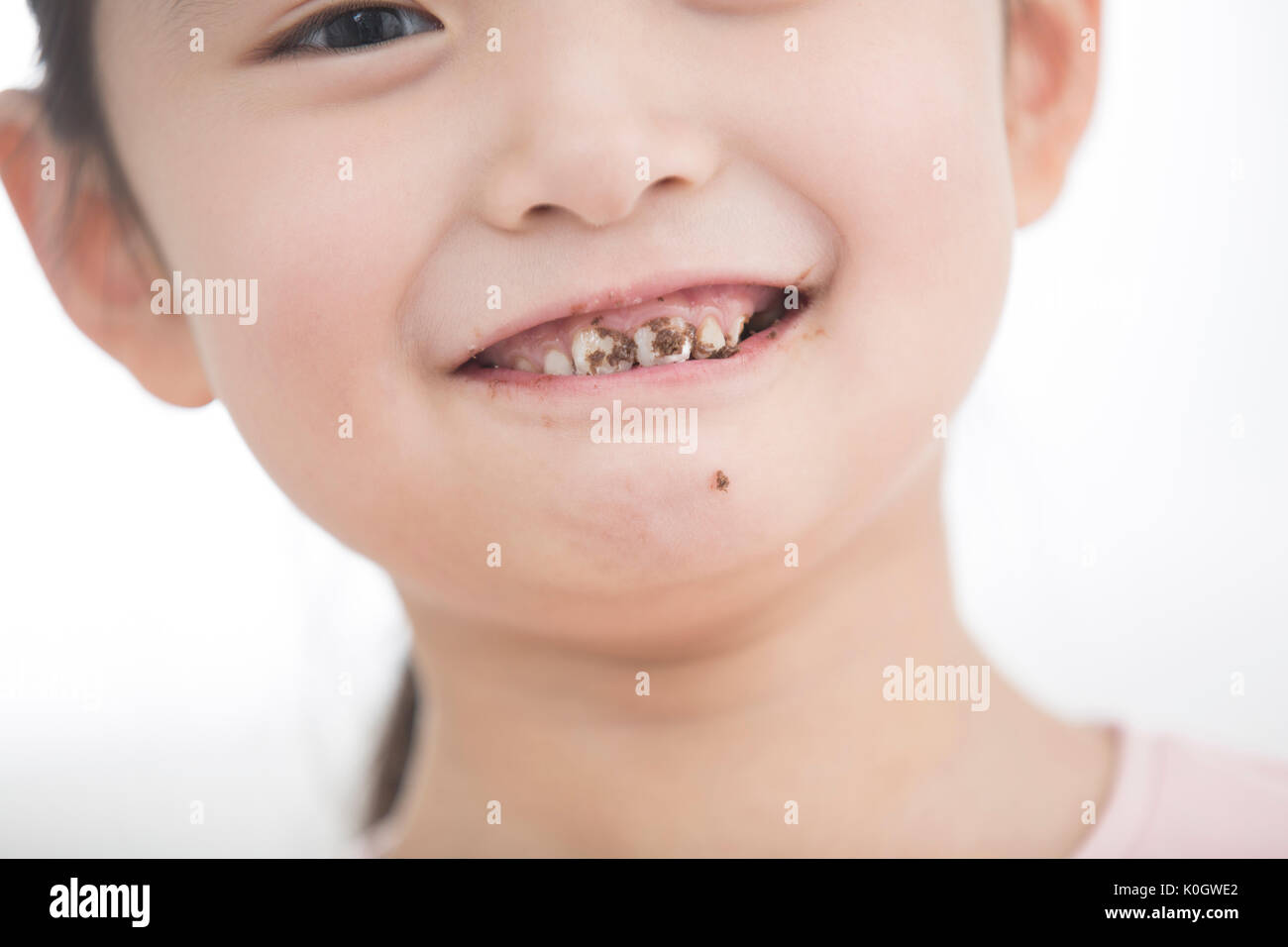 Closeup of smiling girl with her teeth dirty Stock Photo - Alamy