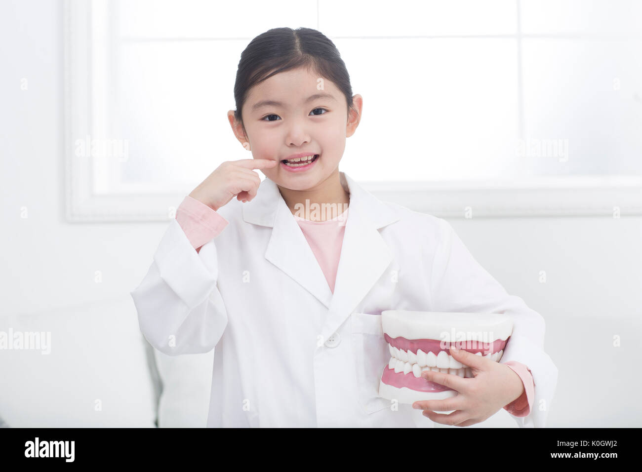 Portrait of girl dressed like a dentist Stock Photo - Alamy