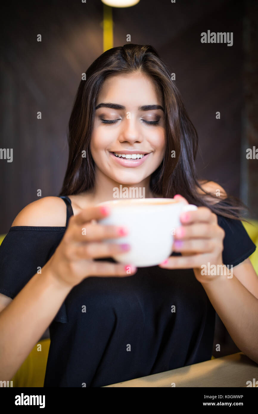 Coffee. Beautiful Girl Drinking Tea or Coffee in Cafe. Beauty Model ...
