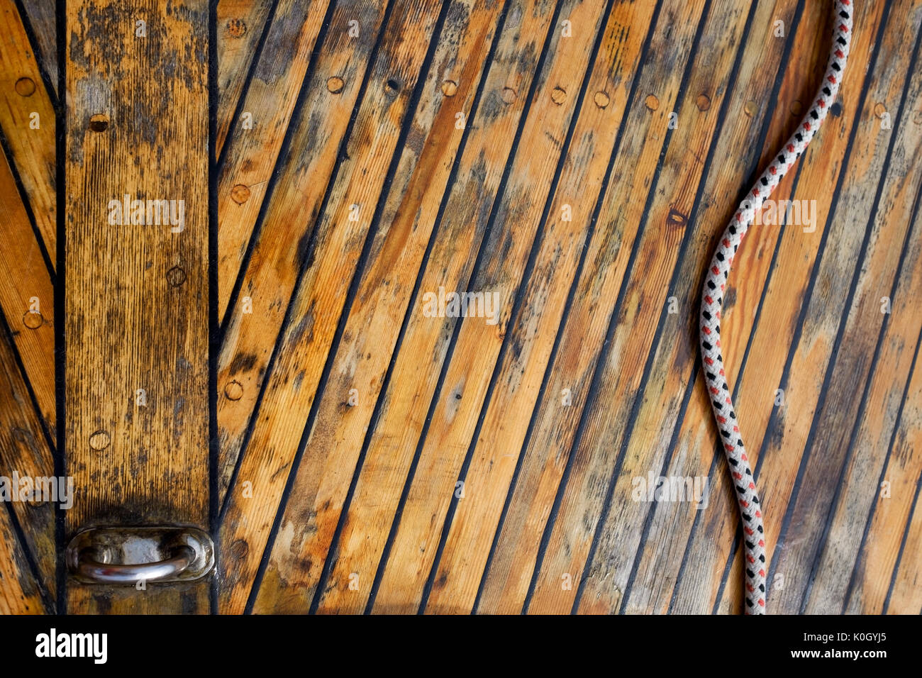 yellow wooden deck with rope Stock Photo - Alamy