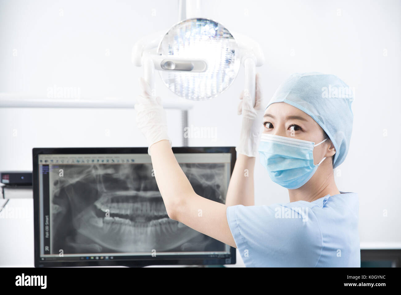 Side view portrait of smiling female dentist Stock Photo - Alamy