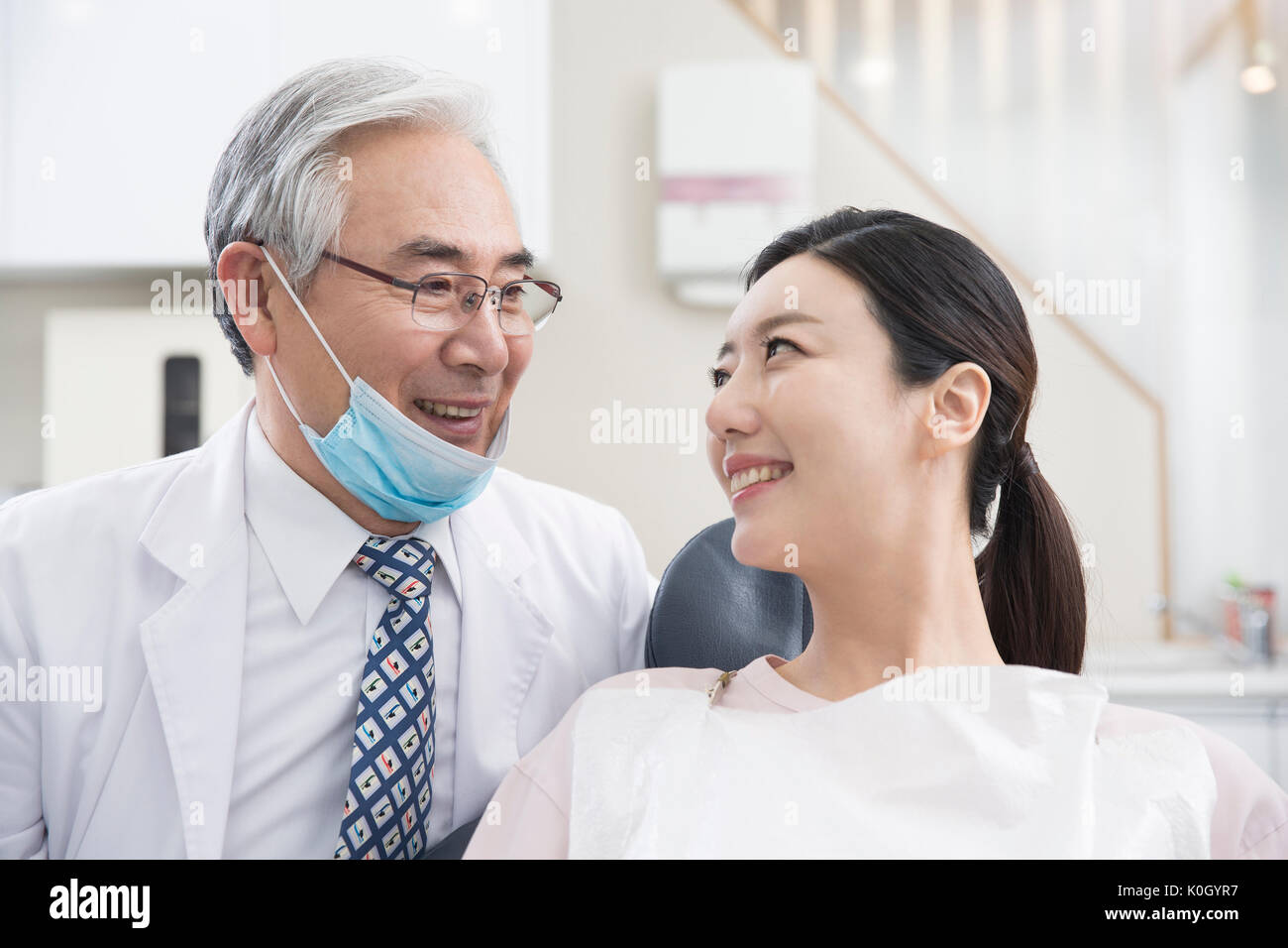 Portrait of smiling dentist and patient Stock Photo - Alamy