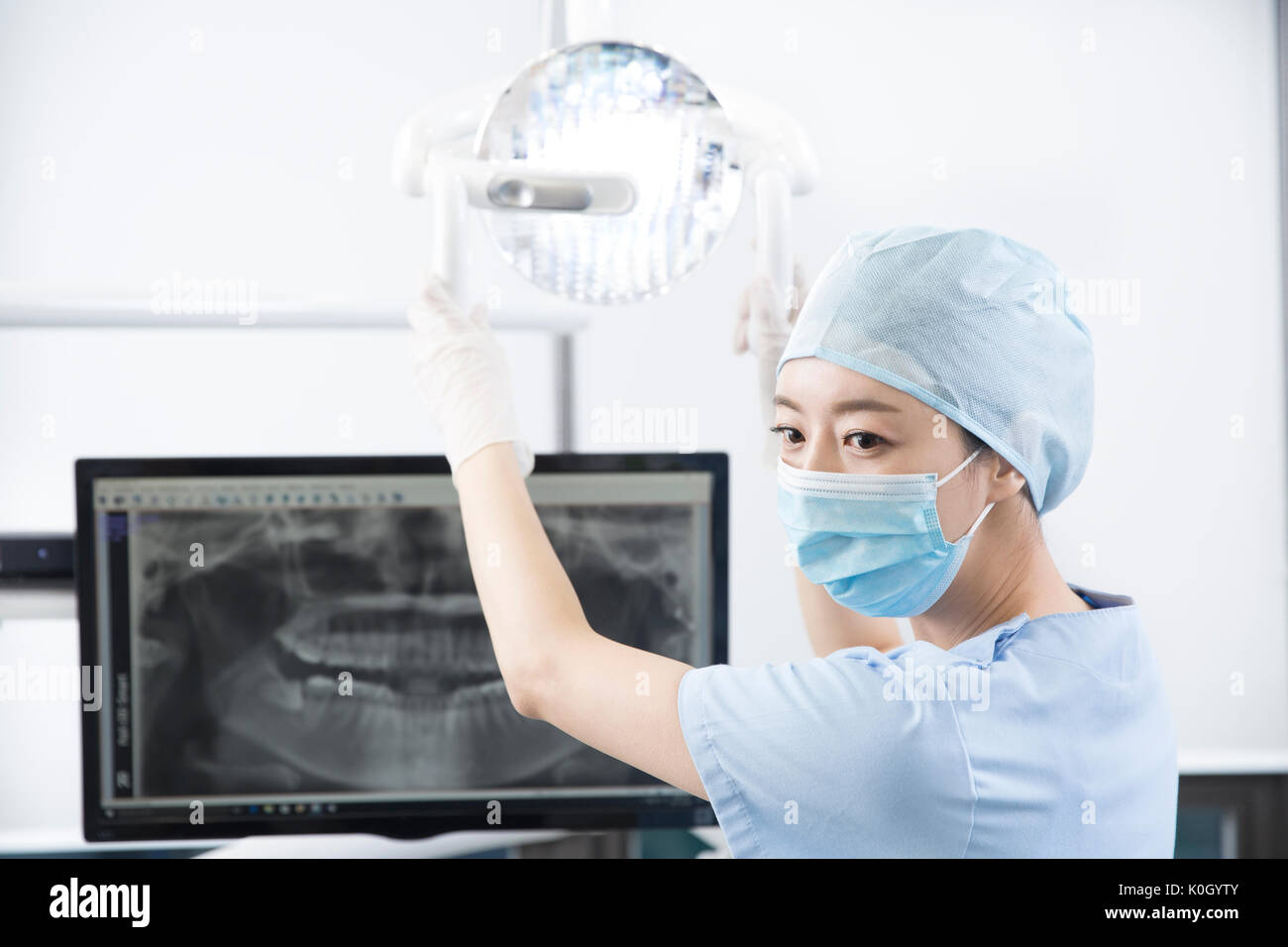 Side view portrait of female dentist in operating dress Stock Photo - Alamy