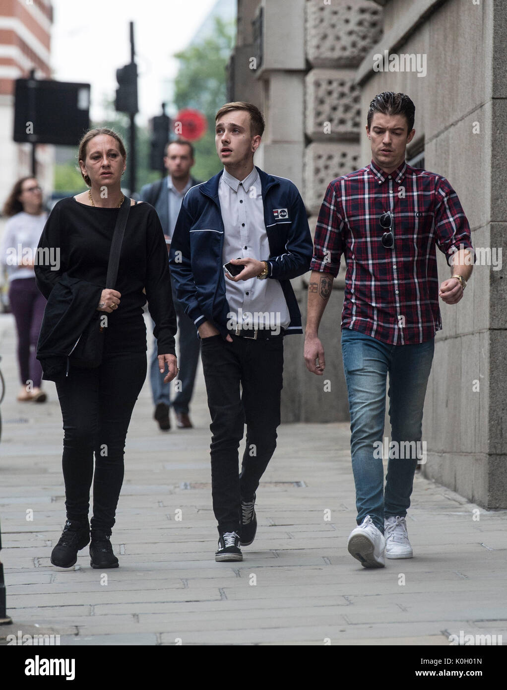 Charlie Alliston, 20 (centre), arrives at the Old Bailey in London ...