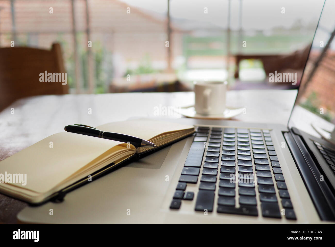 Note pad and keyboard in home office Stock Photo - Alamy