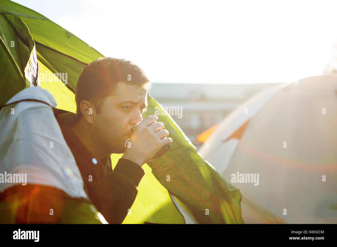 Photo of man in tent Stock Photo - Alamy