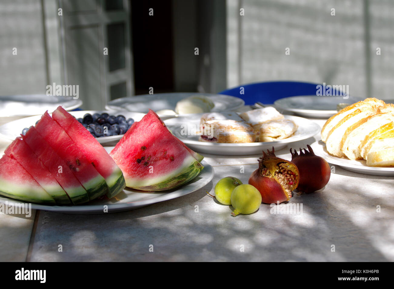 Vegetarian food - a piece of watermelon, figs and other fruits on the ...