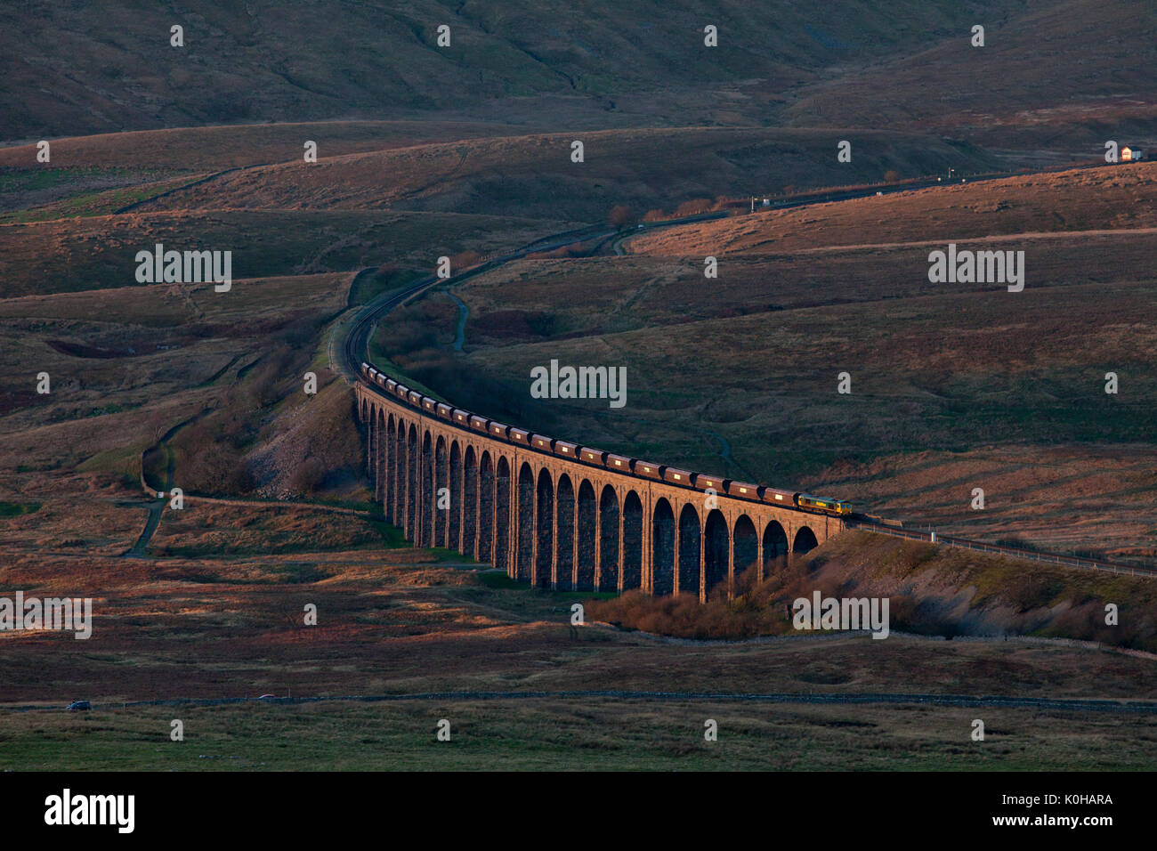 Freightliner Class 66 locomotive hauling train of coal crosses ...