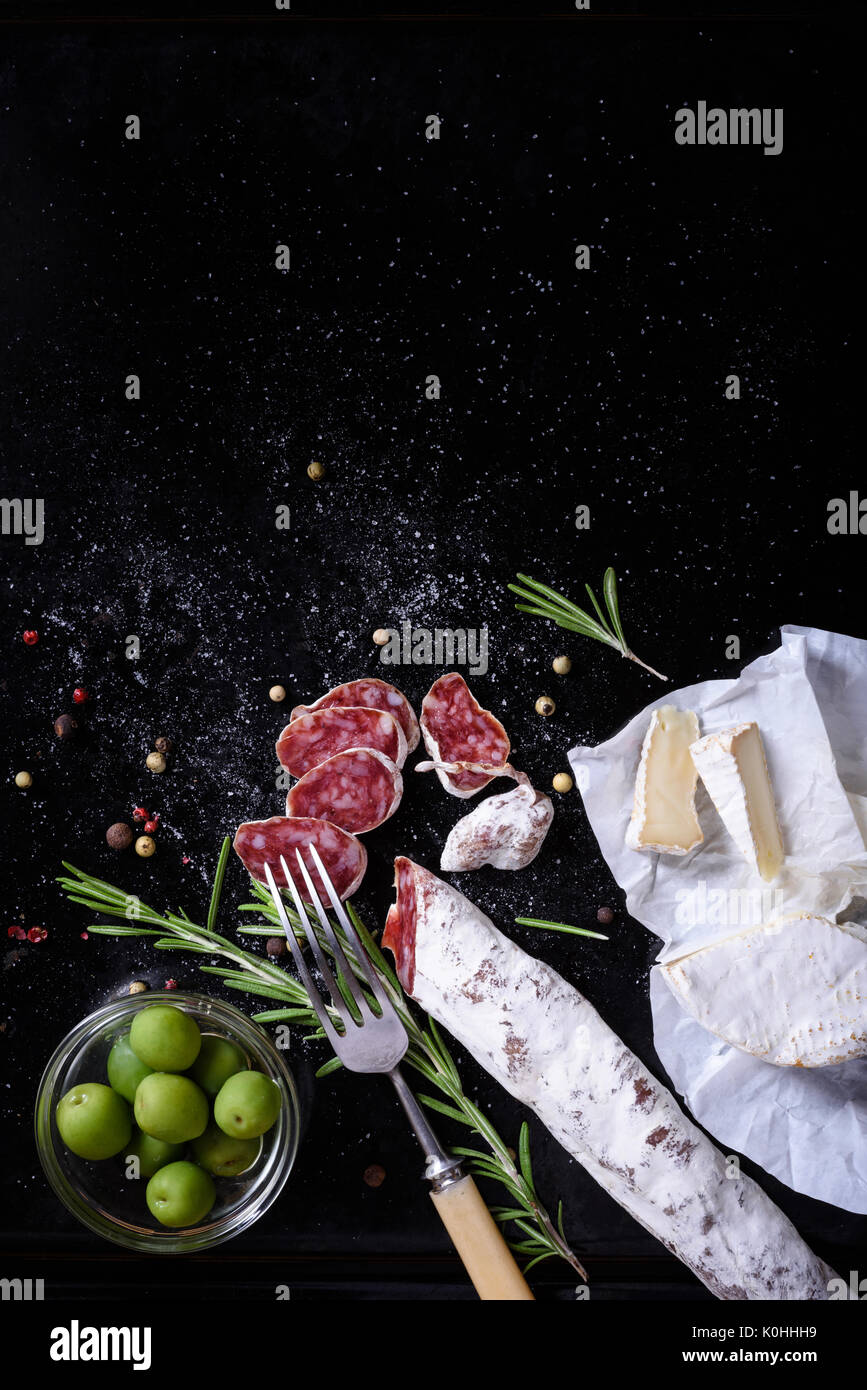 Traditional spanish snack fuet salami sausage with cheese and olives ...