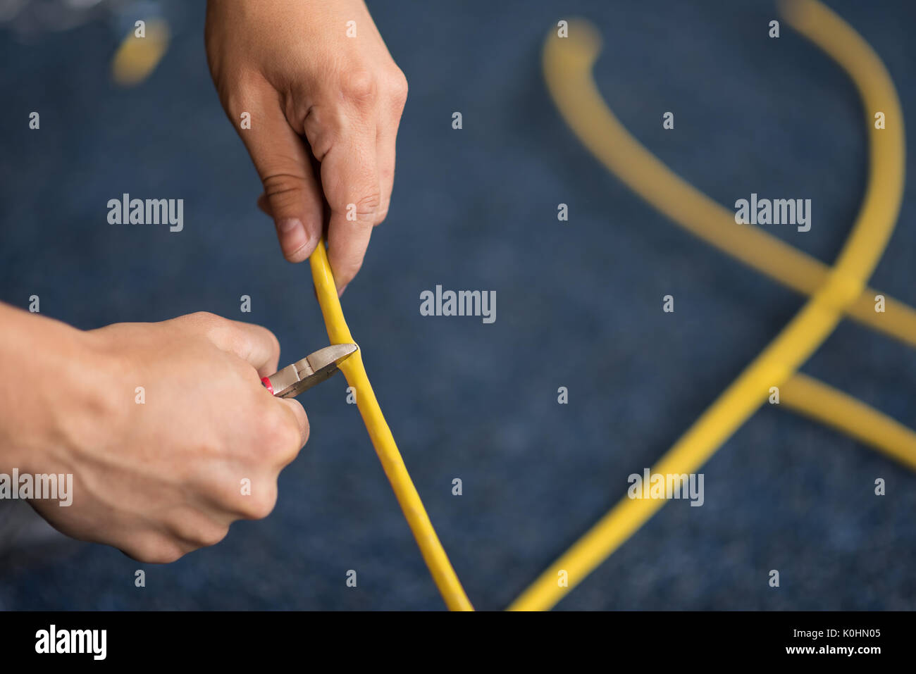 Cutting of the network cable with cutters, process of laying the local ...