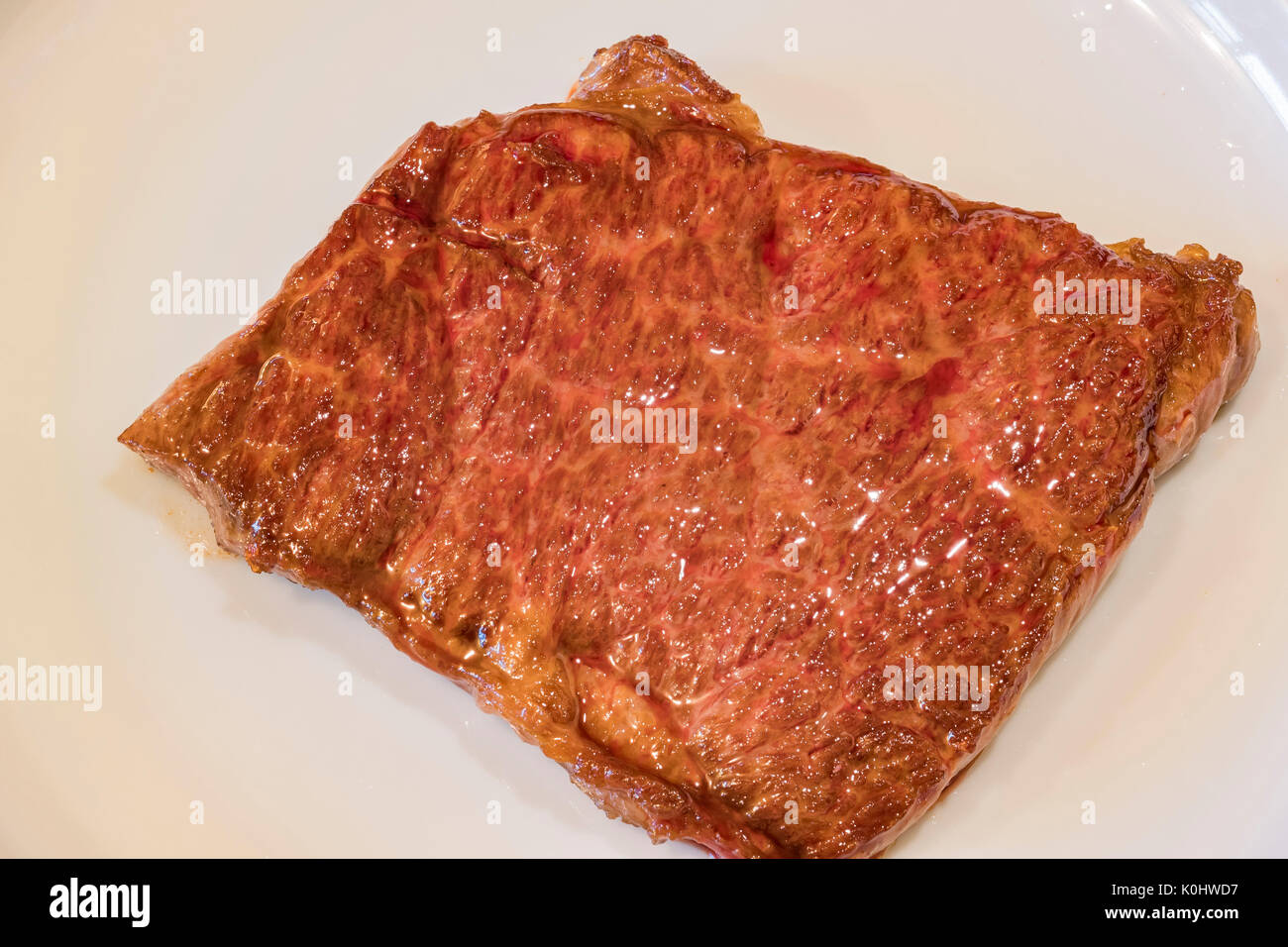 medium rare cooked Wagyu beef sit on a white plate Stock Photo - Alamy