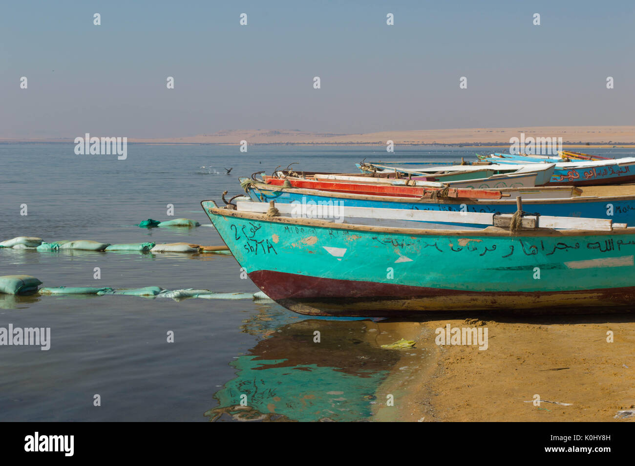 Fisherman line their boats up to dock on the Wadi el Rayan lake in the ...