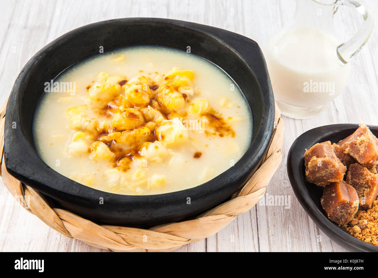 Traditional Colombian corn mazamorra served in black ceramic dish Stock ...