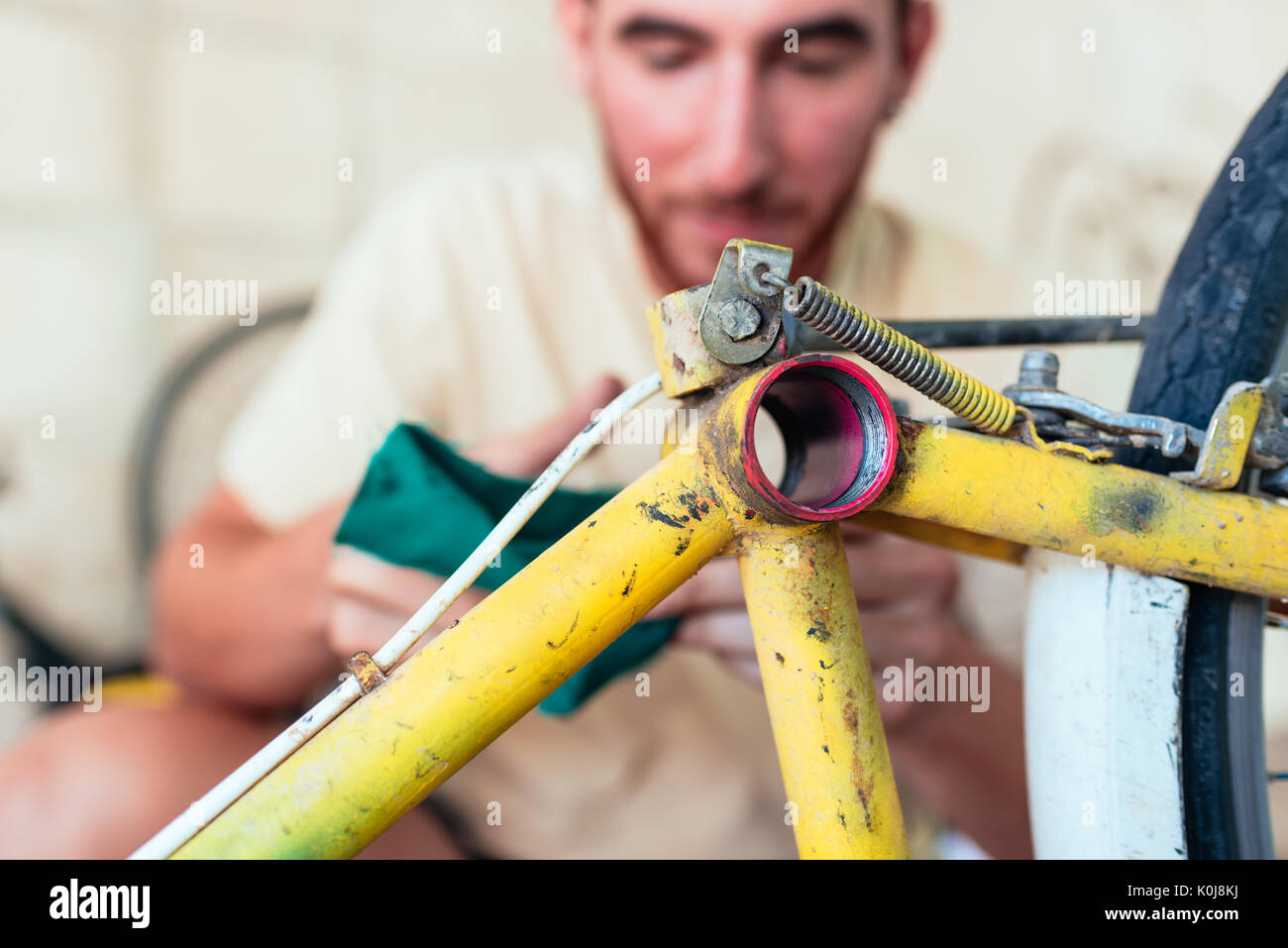 Vintage Bike being repaired by a Cute Boy Stock Photo - Alamy