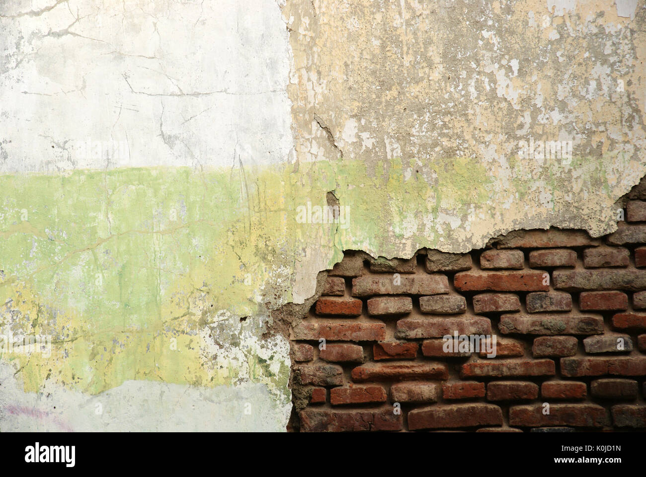 Broken old brick wall photo in Semarang, Indonesia Stock Photo - Alamy