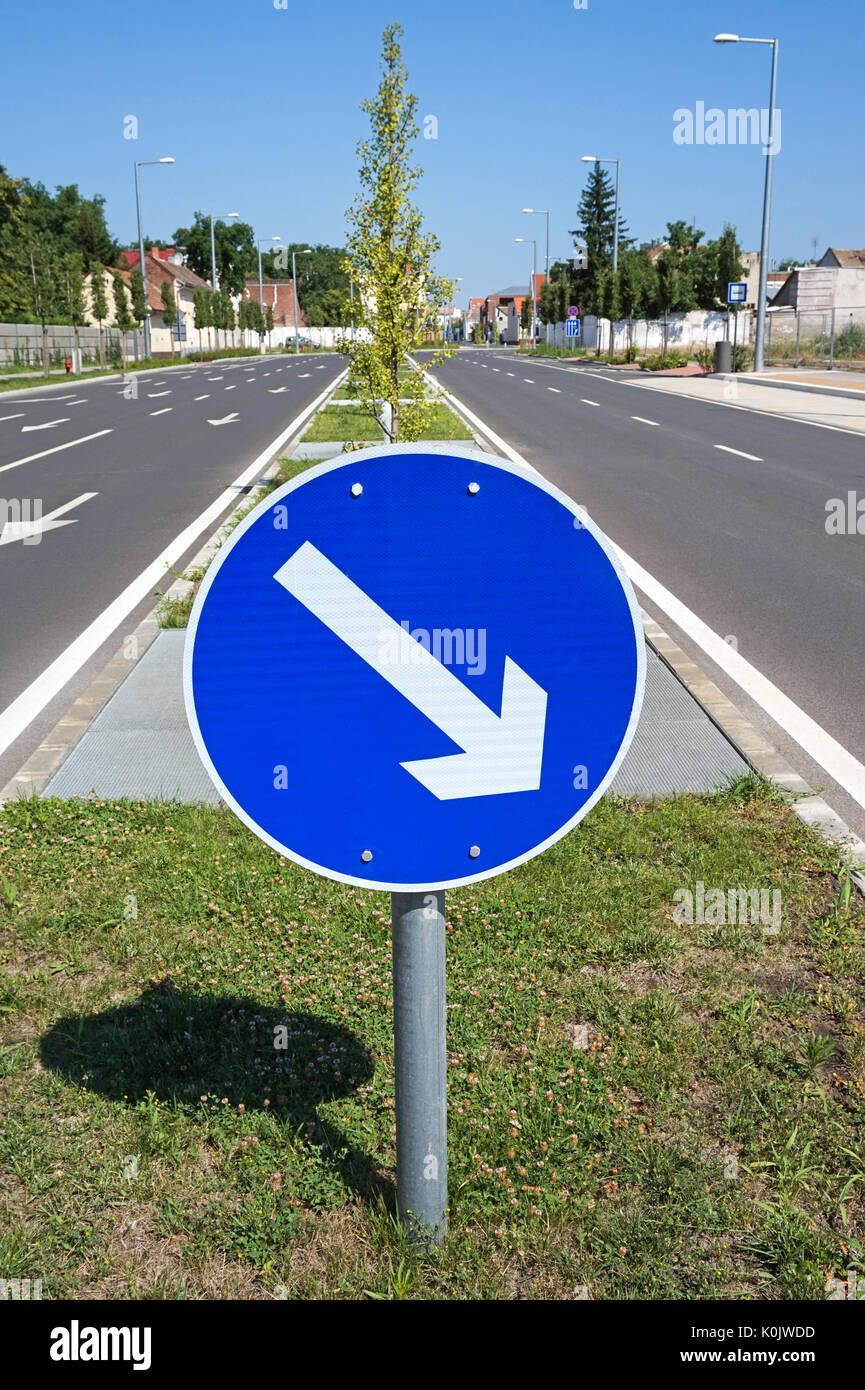 Directional arrow sign on the street in the city Stock Photo - Alamy