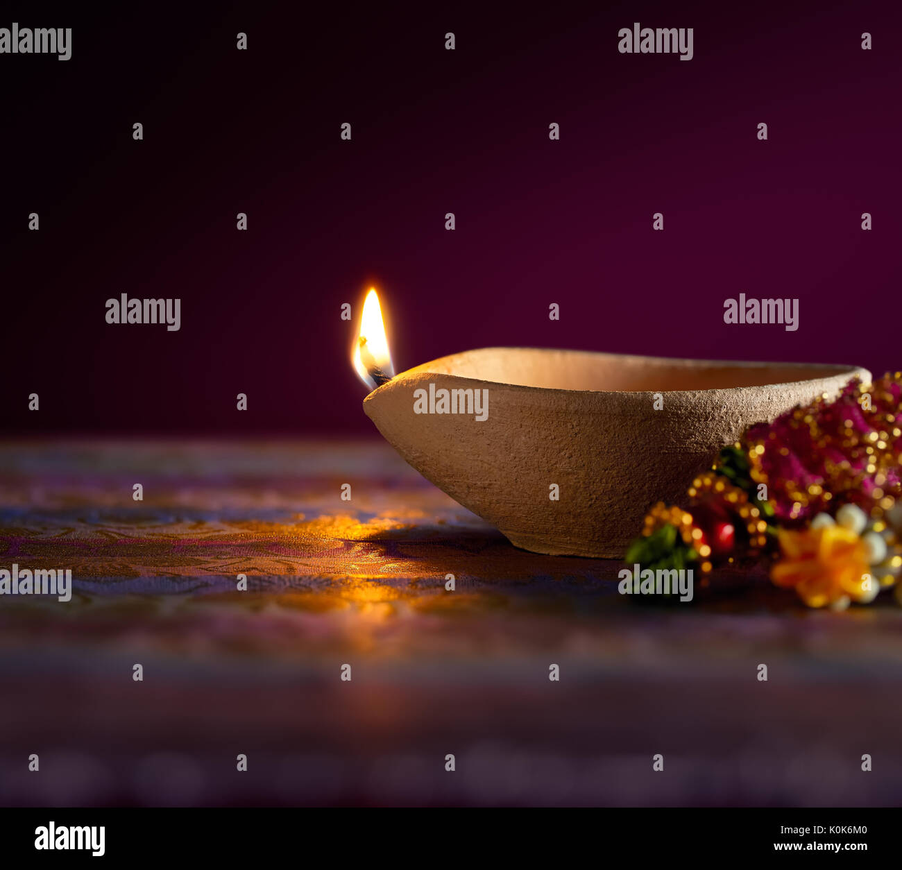 Traditional clay diya lamps lit during Diwali celebration Stock Photo ...