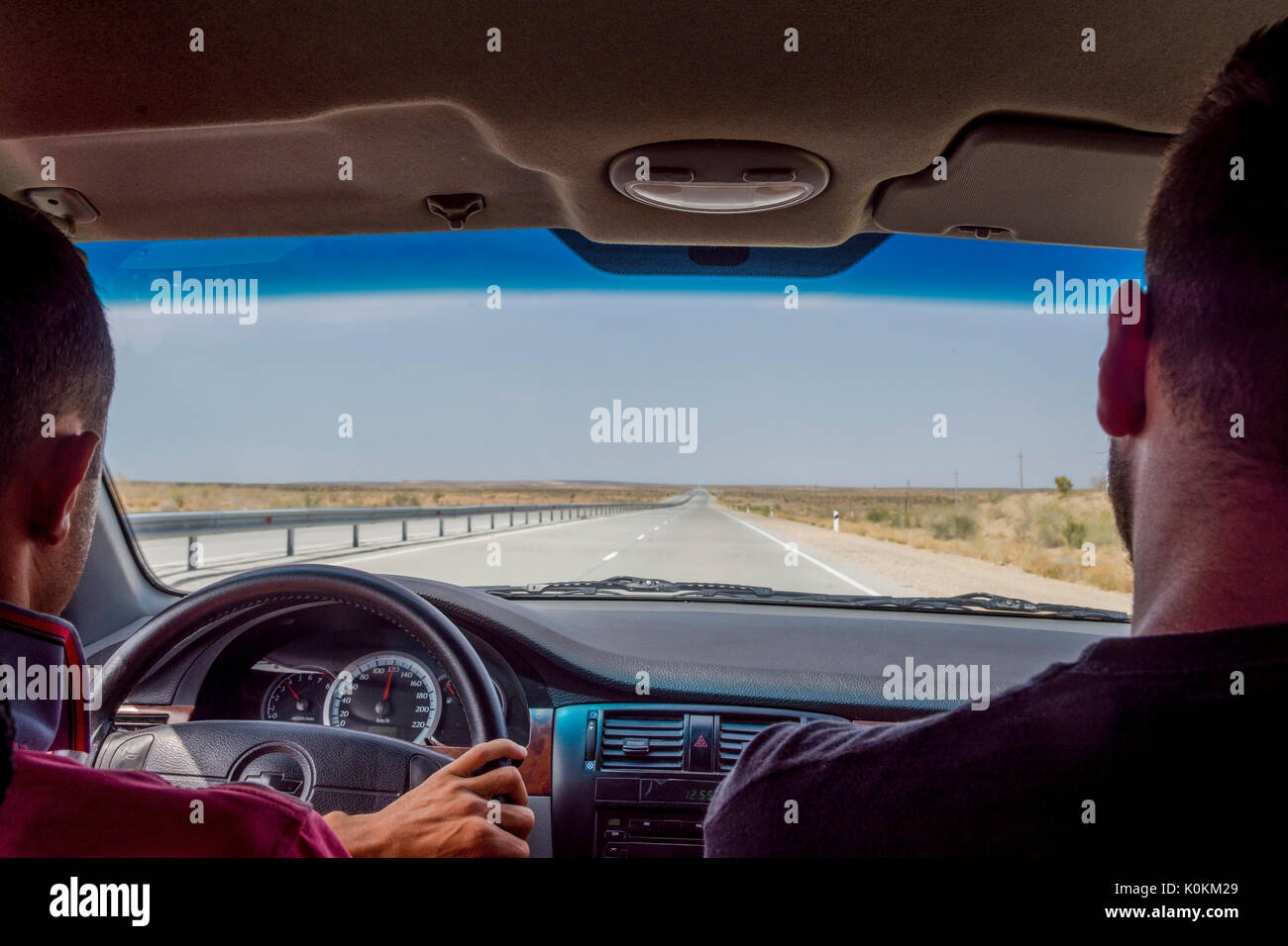 Driving in a car on empty highway, Uzbekistan Stock Photo - Alamy