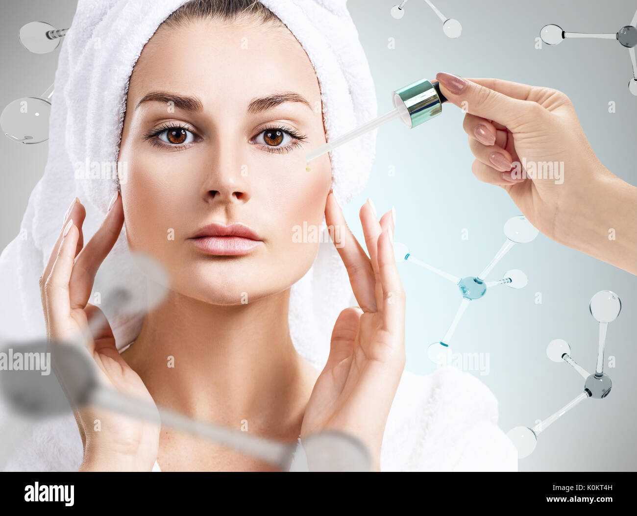 Cosmetics oil on face among the molecules Stock Photo - Alamy