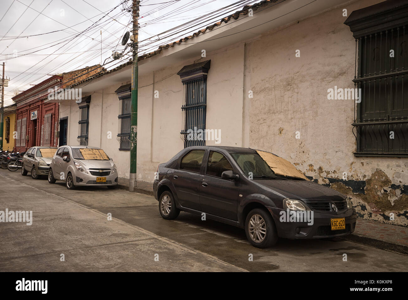 July 10, 2017 Buga, Coombia: the windshield of parked cars are covered ...