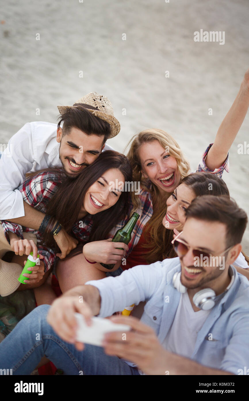 Group smiling cheerful friends hi-res stock photography and images - Alamy