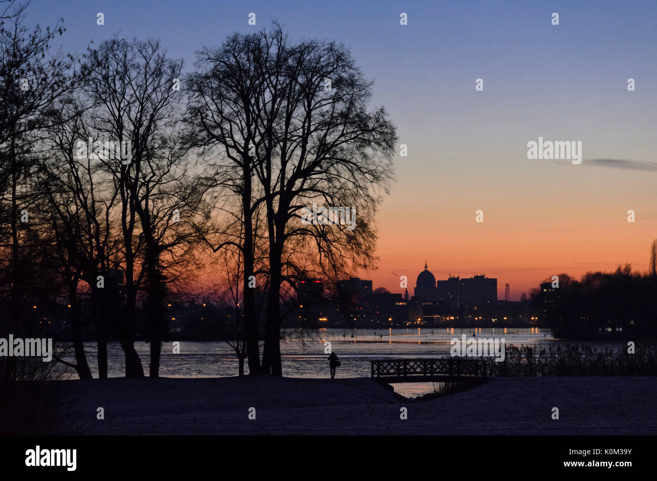Glienicke Lake and silhouette of Potsdam at sunset, Germany Stock Photo ...