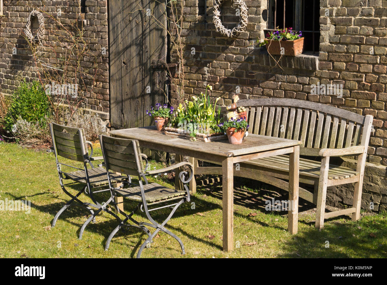 Seating area with spring decoration in front of a barn Stock Photo - Alamy