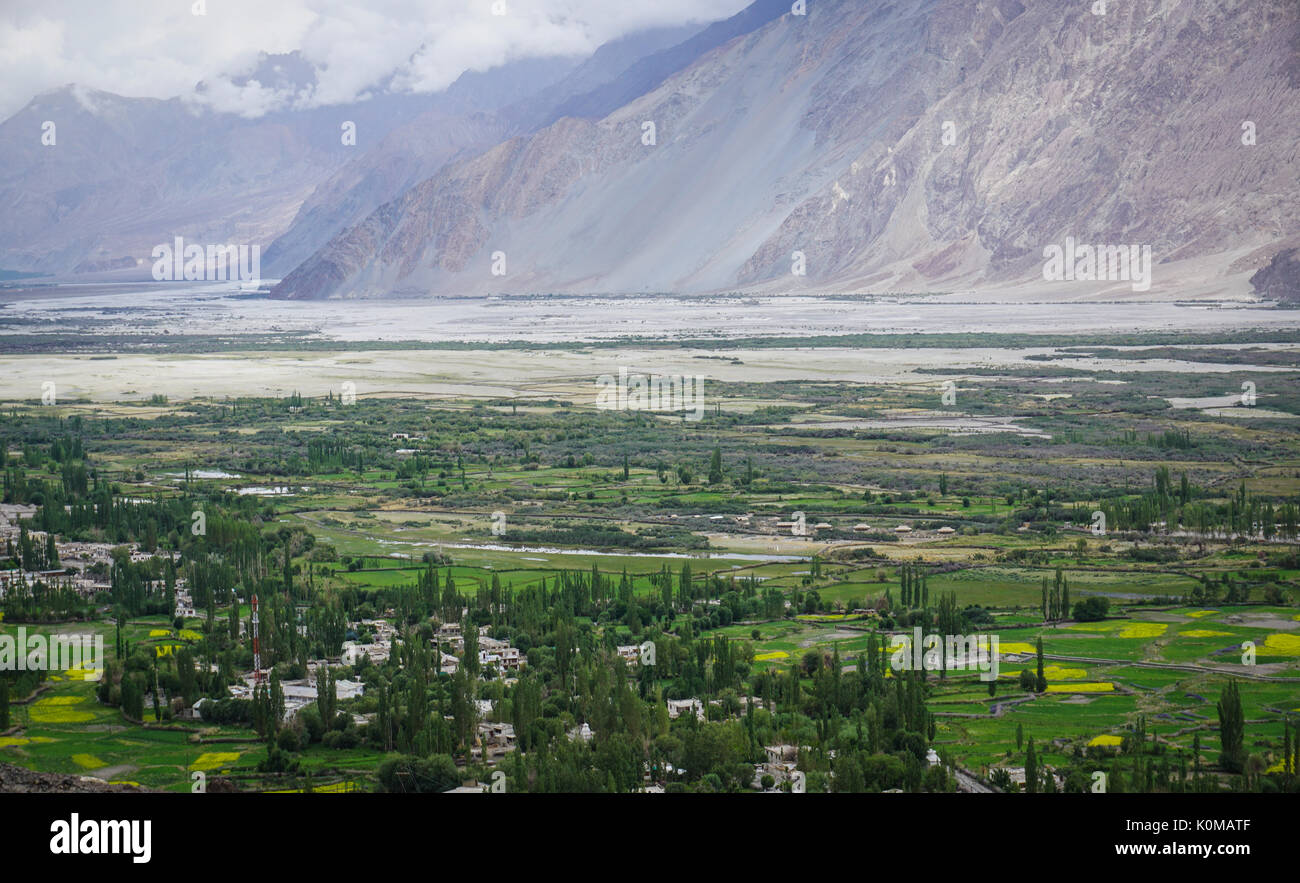 Green valley with Tibetan village in Ladakh, India. Ladakh is the ...