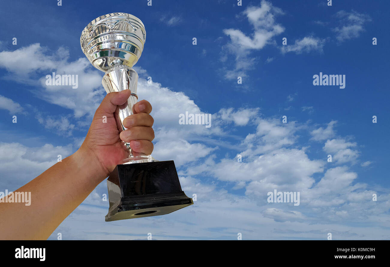 Hand holding trophy hi-res stock photography and images - Alamy