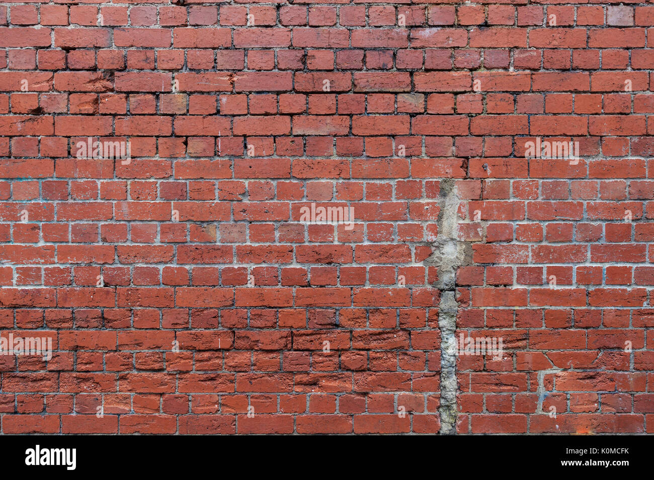 Decaying grungy red brick wall texture background Stock Photo - Alamy
