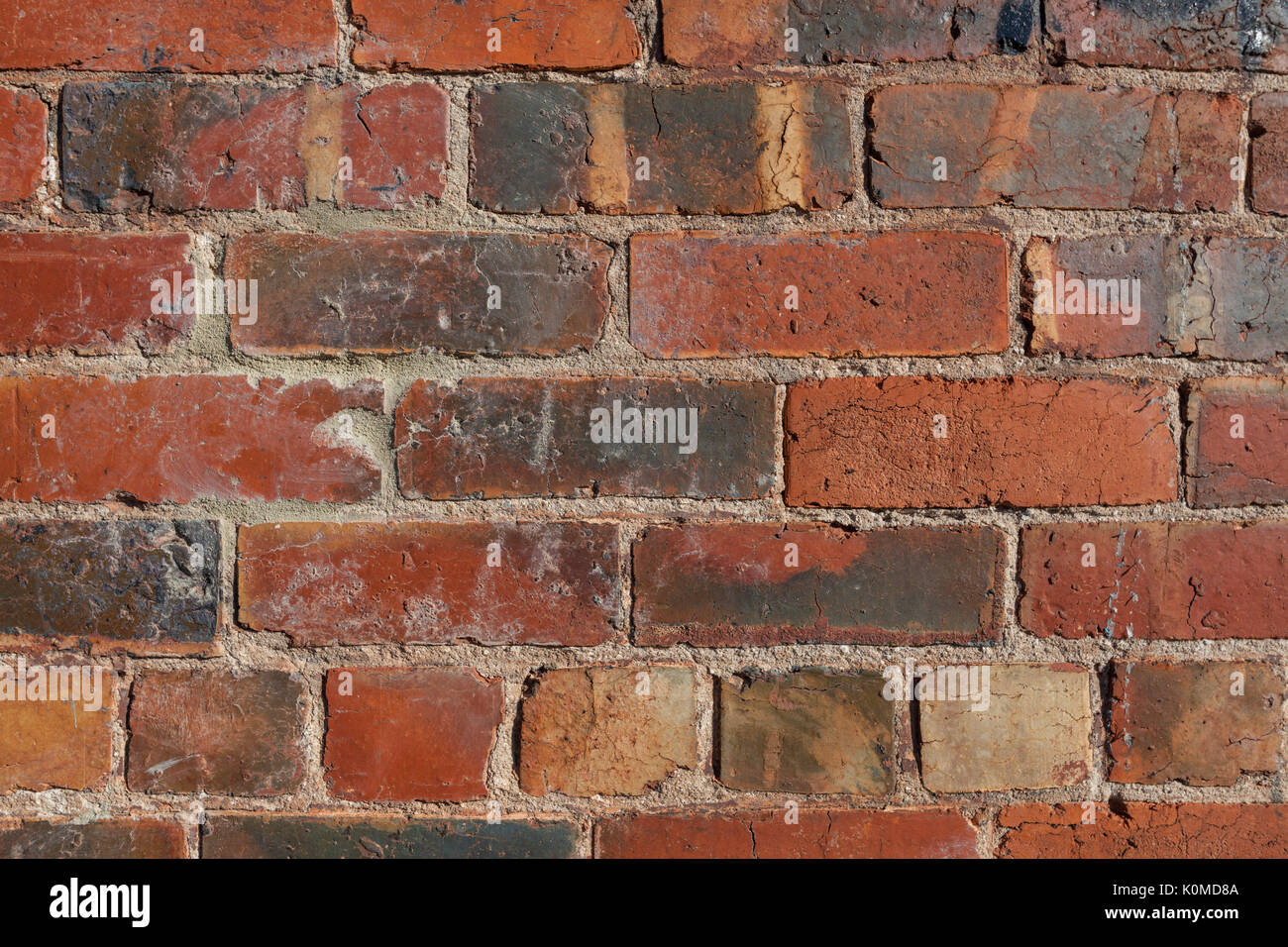 Old decaying cracked brick wall texture background closeup Stock Photo - Alamy
