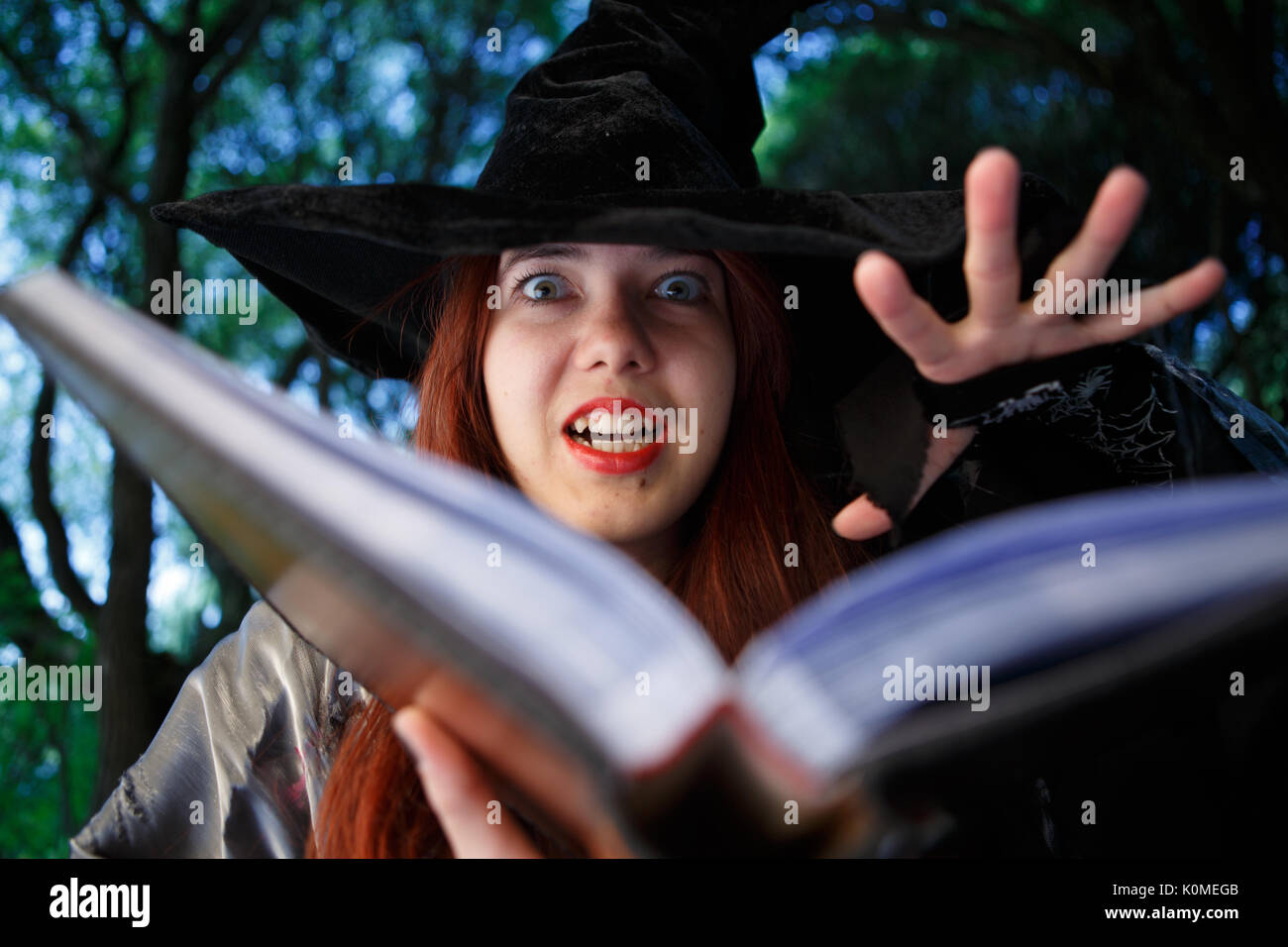 Photo close-up of witch reading spell Stock Photo - Alamy
