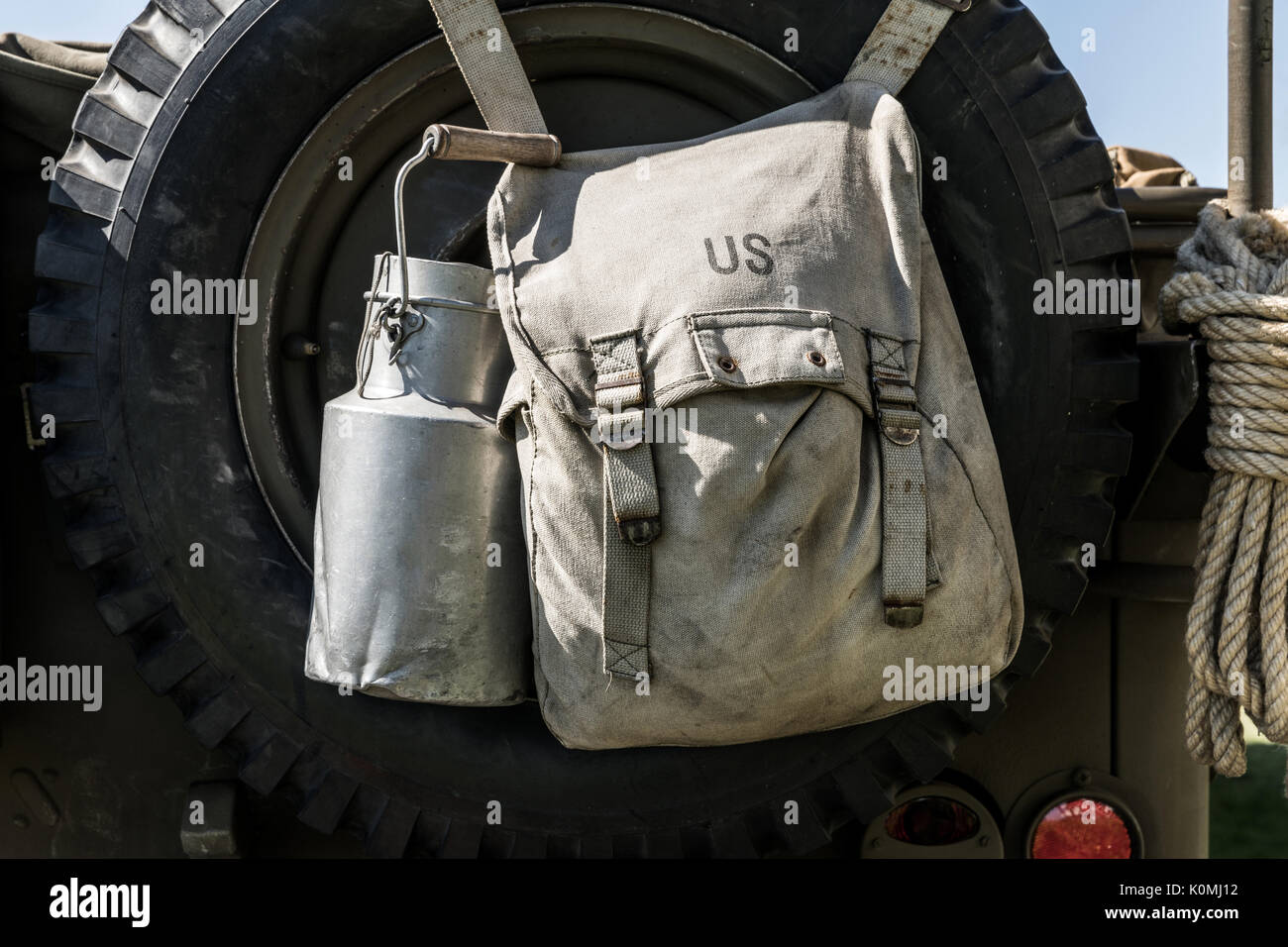 American military bag and a milk pot in the back of a vehicle Stock ...