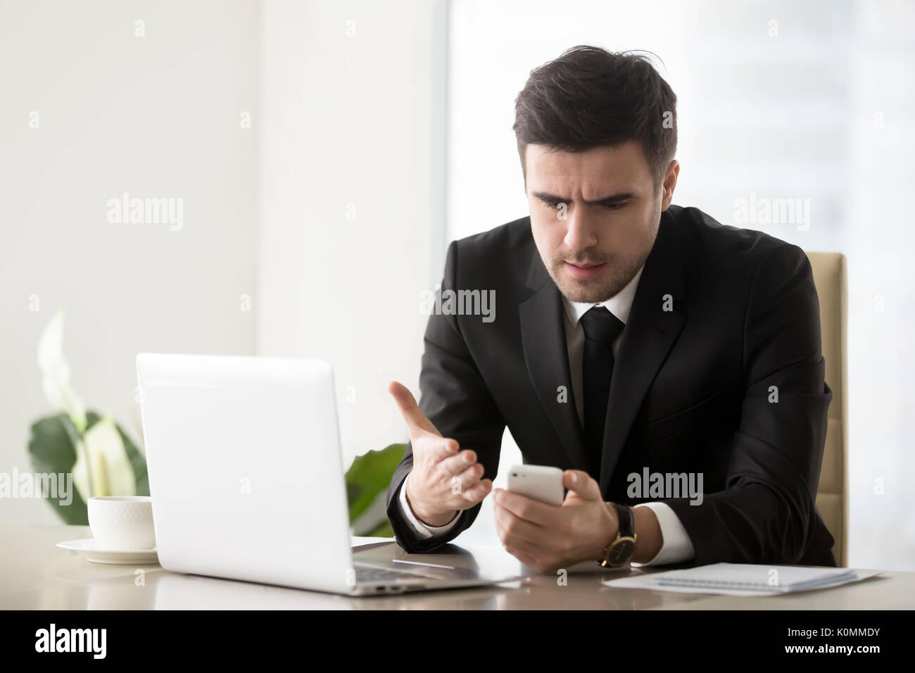 Irritated businessman annoyed with phone call, bad message, brok Stock ...