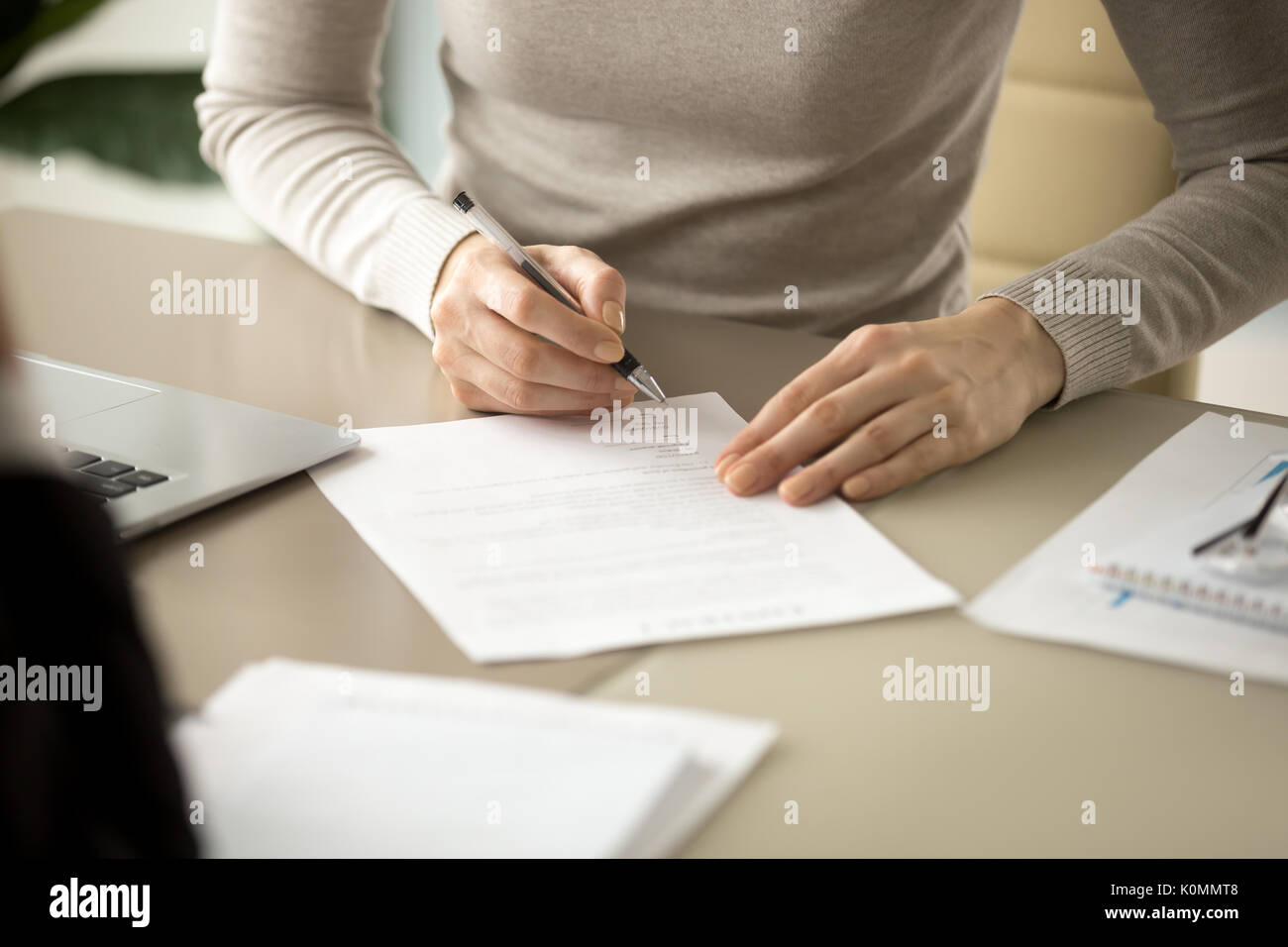 Woman signing document, focus on female hand putting signature Stock ...