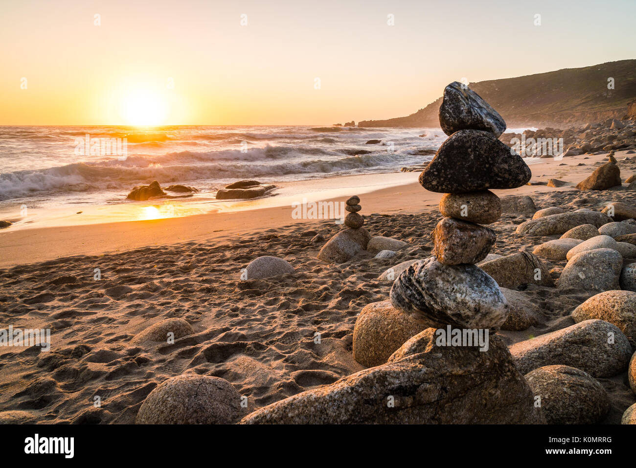 Rock balancing at sunset Stock Photo - Alamy