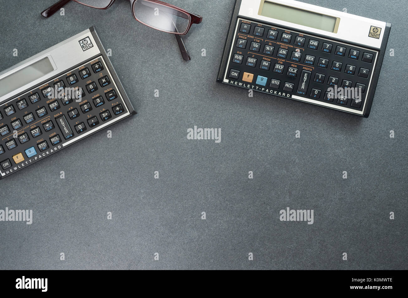 digital personal calculators on a desktop Stock Photo - Alamy