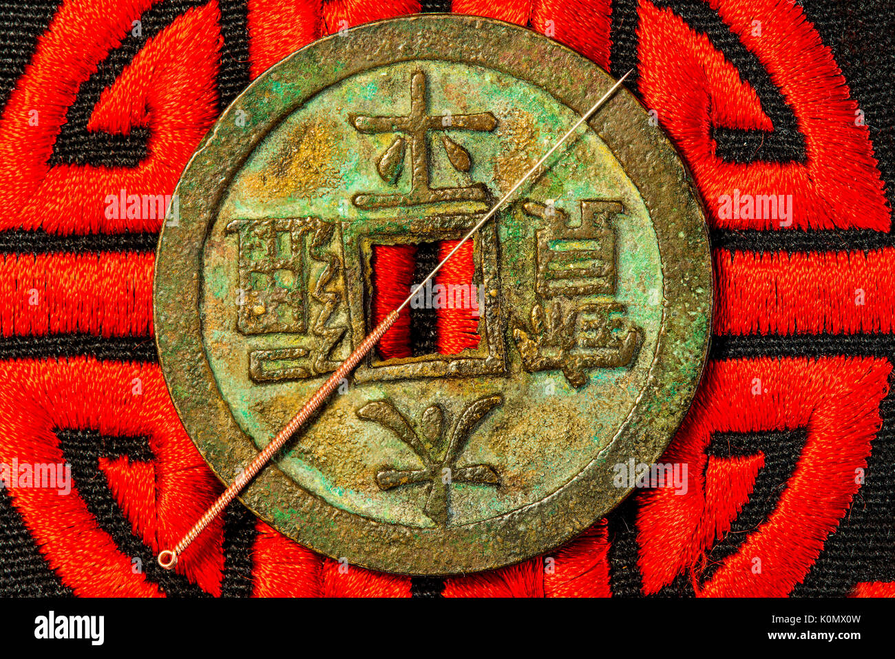 acupuncture needle on Chinese coin and symbol for imortality Stock ...