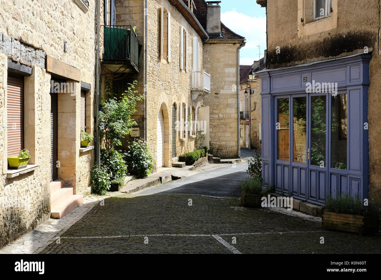 A typical street view of a town, Le Bugue, in southern France in the ...