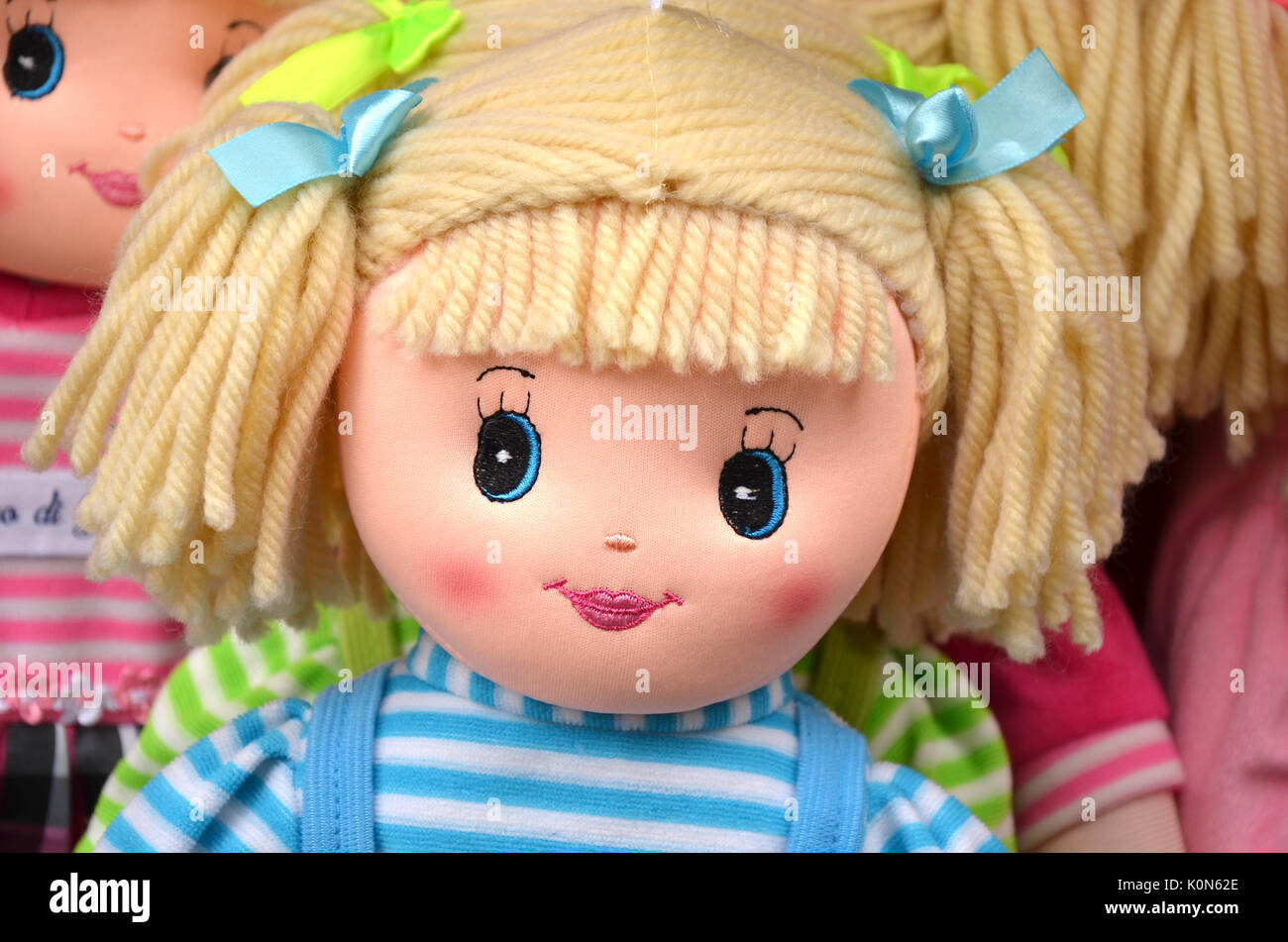 happy girl doll toy Stock Photo - Alamy