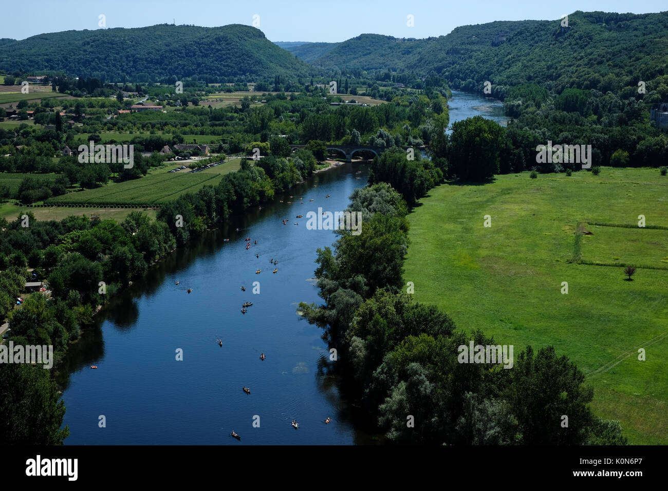 View of canoeists on the river Dordogne from the chateau of Beynac ...