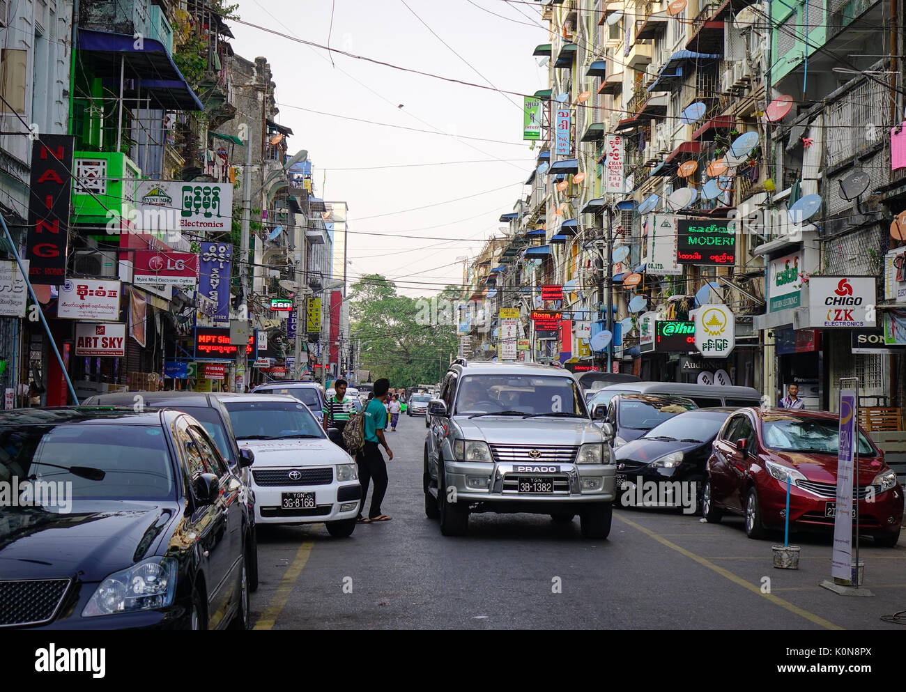 Yangon, Myanmar - Feb 13, 2017. Old street with buildings at Chinatown ...