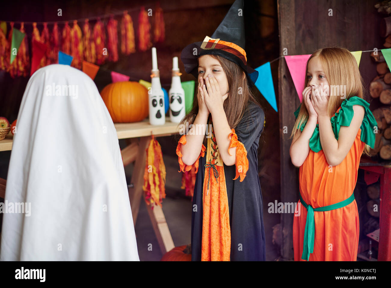 Little girls afraid of the ghost Stock Photo - Alamy