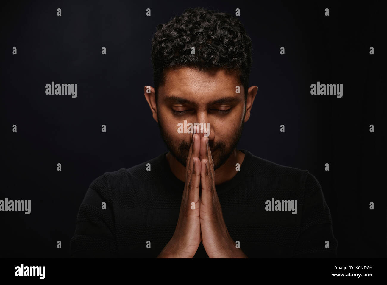 Portrait of praying man Stock Photo - Alamy